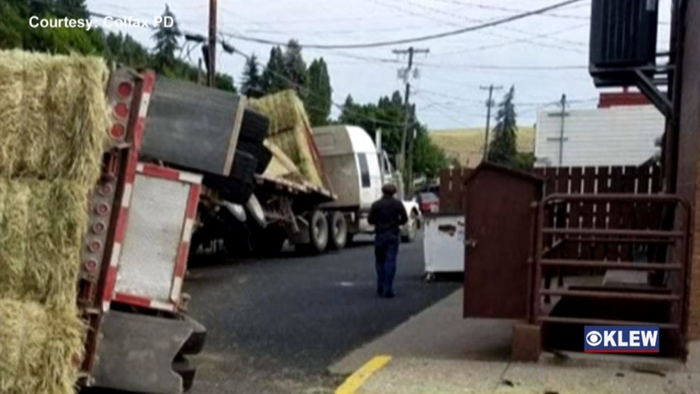 Semi-truck brakes fail, driver tips load into alley | KLEW